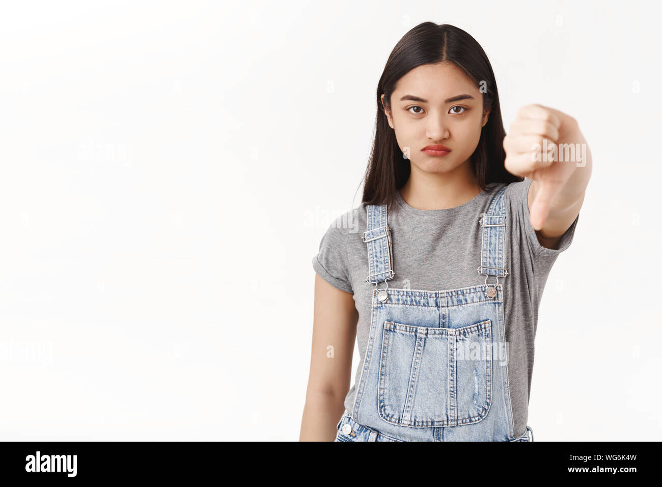 Ignorant displeased whining silly teenage asian girl disliking present ...