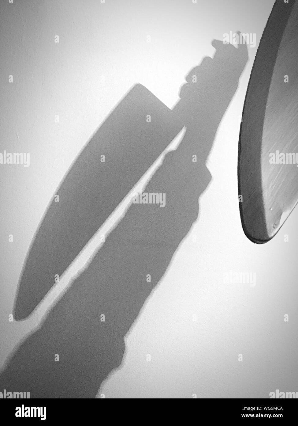 Person with knife shadow hi-res stock photography and images - Alamy