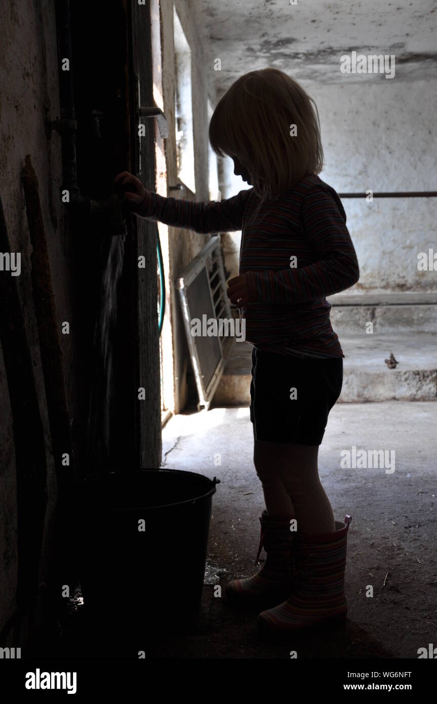 Child in bucket hi-res stock photography and images - Alamy
