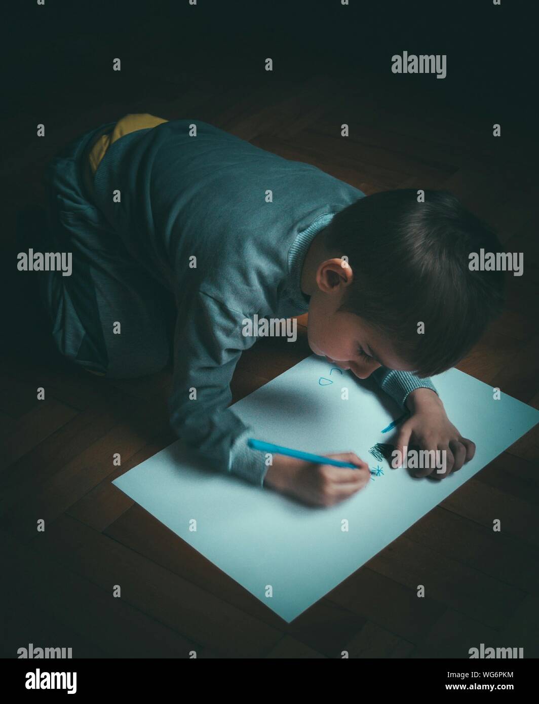 Boy drawing on paper hi-res stock photography and images - Alamy