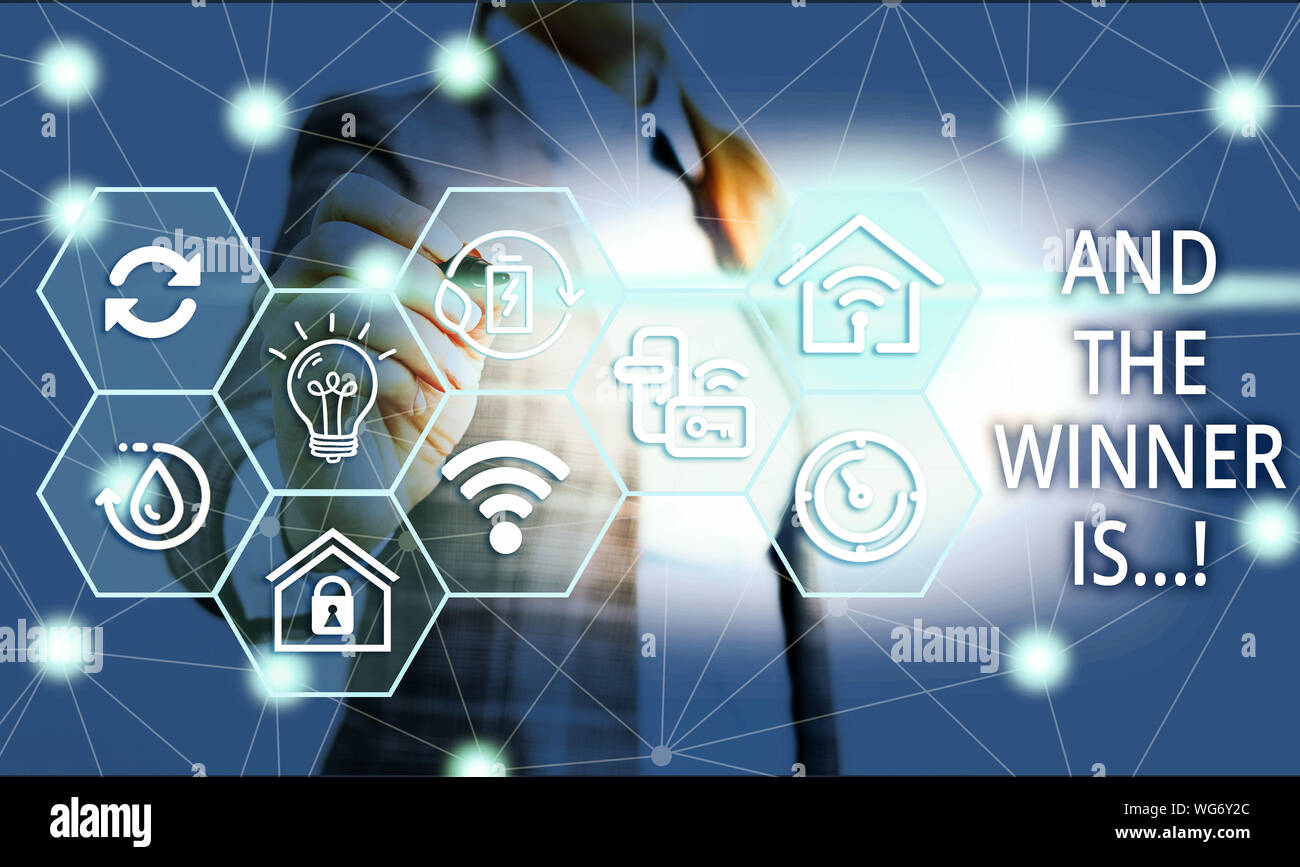 Handwriting text writing And The Winner Is. Conceptual photo announcing ...