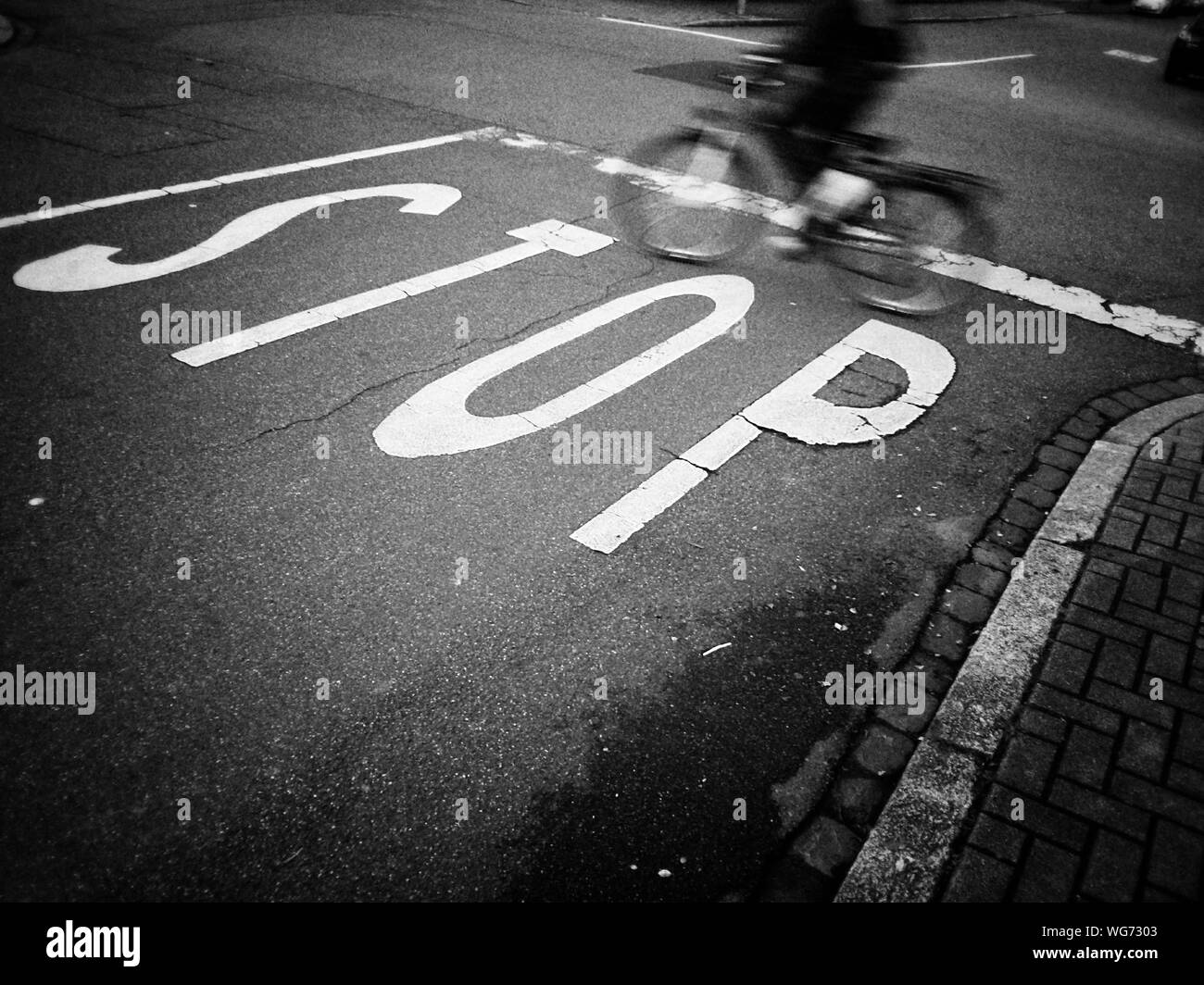 Stop sign on asphalt Black and White Stock Photos & Images - Alamy