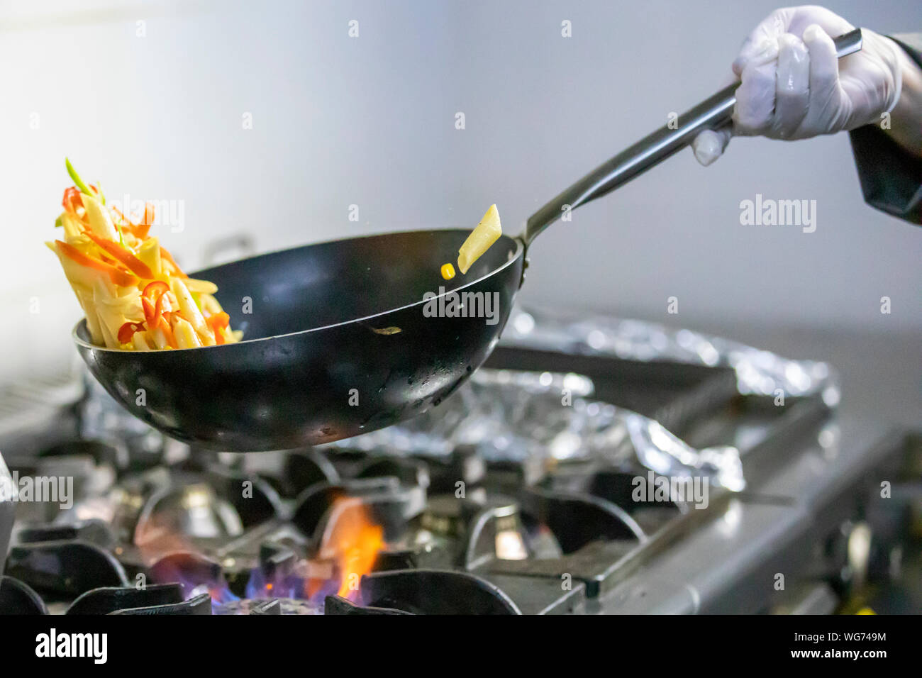 Chef stirring food hi-res stock photography and images - Alamy