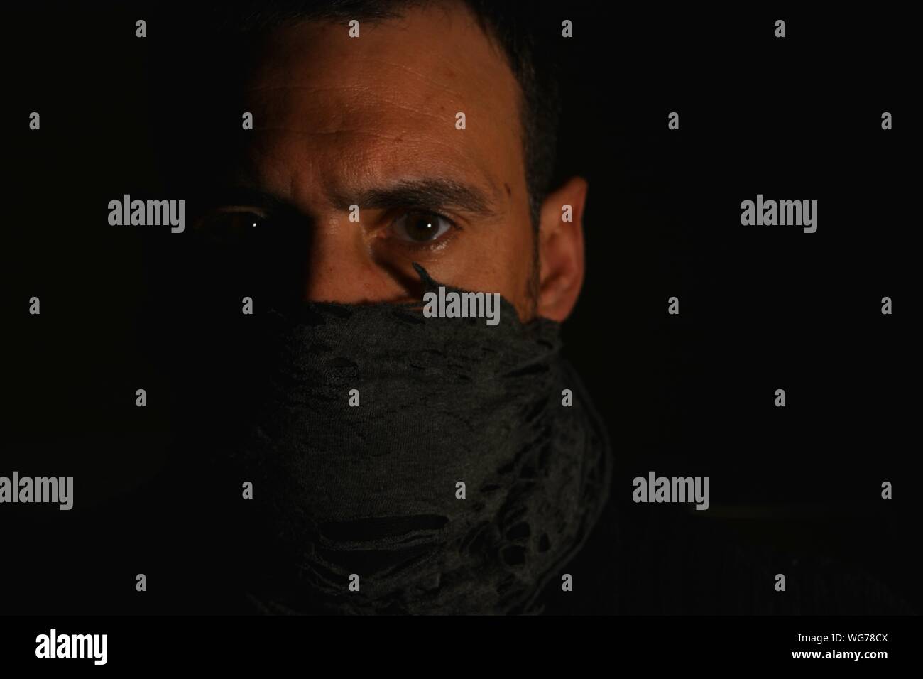 Man covering face scarf hi-res stock photography and images - Alamy