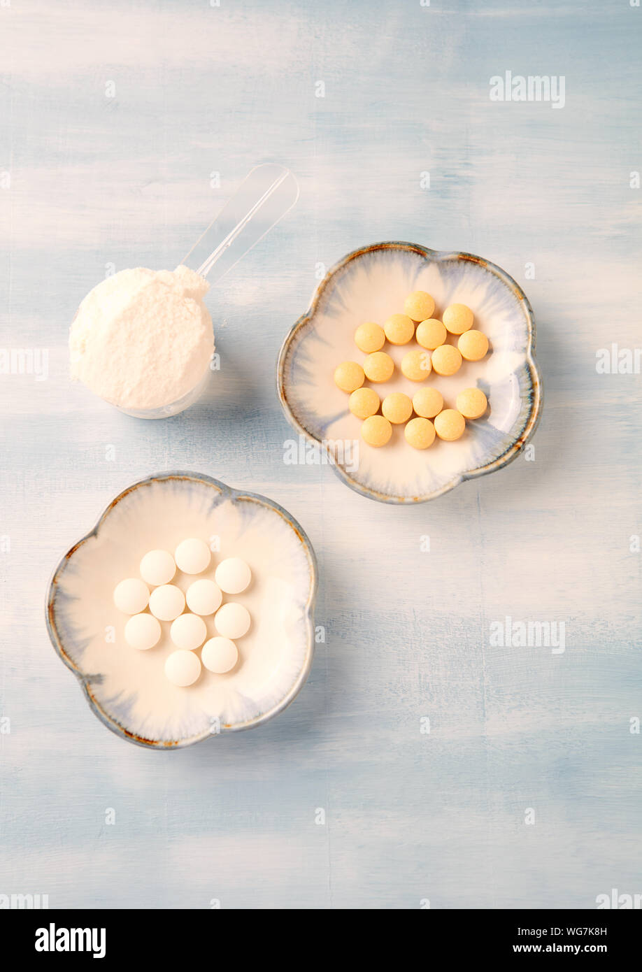 Collagen powder, Hyaluronic Acid and Vitamin C tablets. Supplements to ...