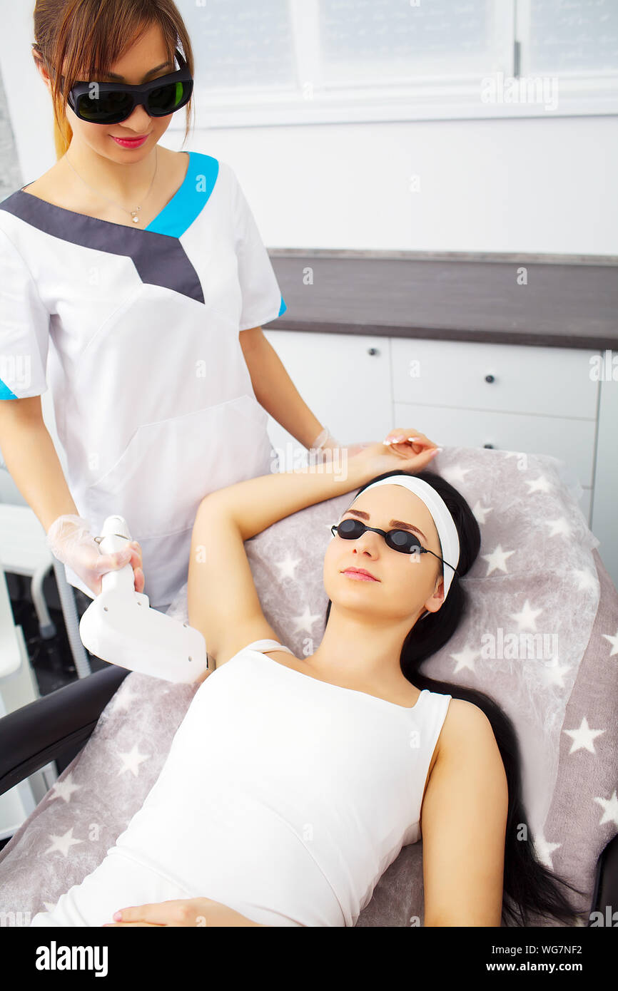 Woman having underarm Laser hair removal epilation Stock Photo - Alamy