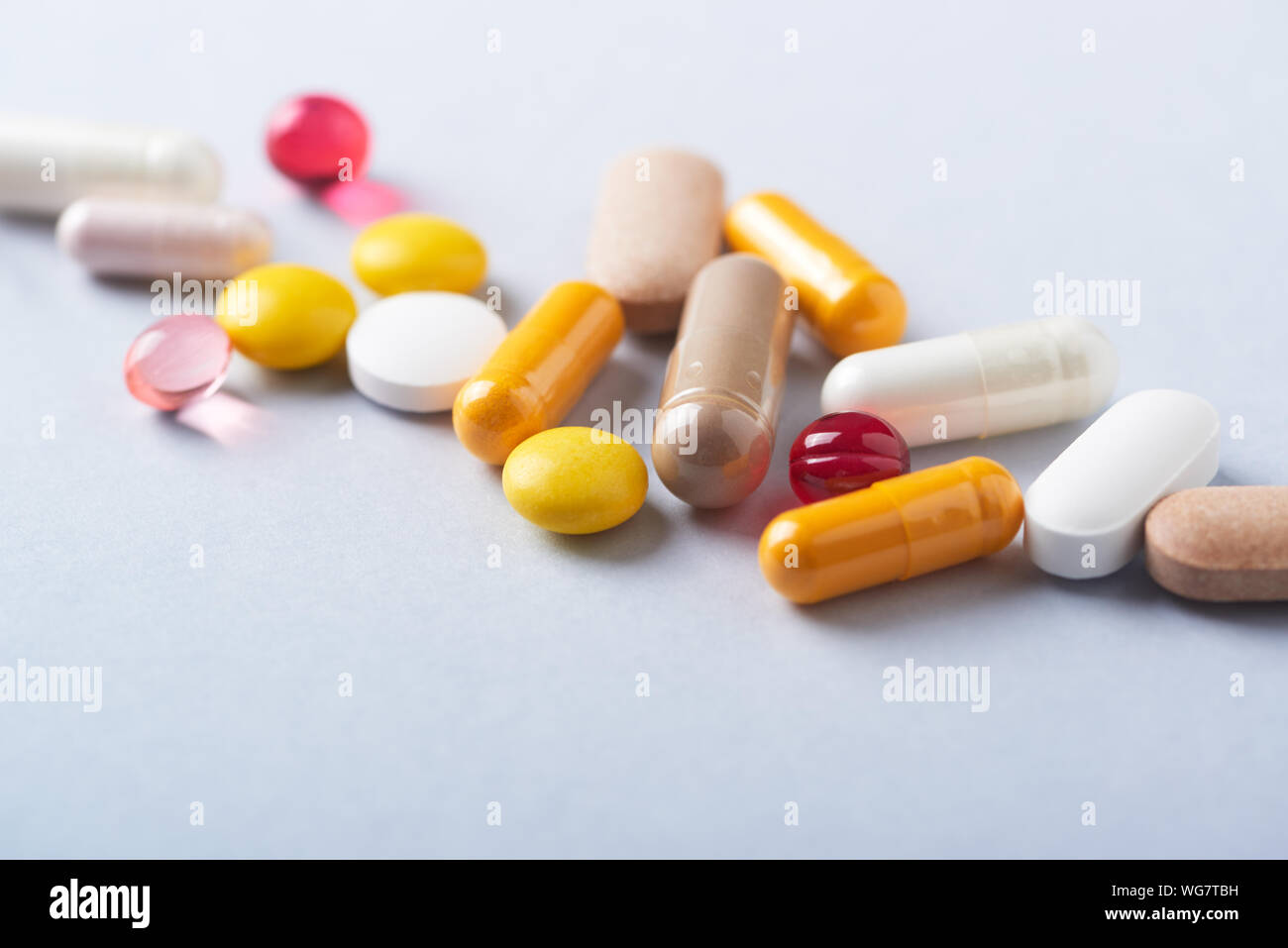 Vitamins and supplements on bright paper background. Concept for a ...