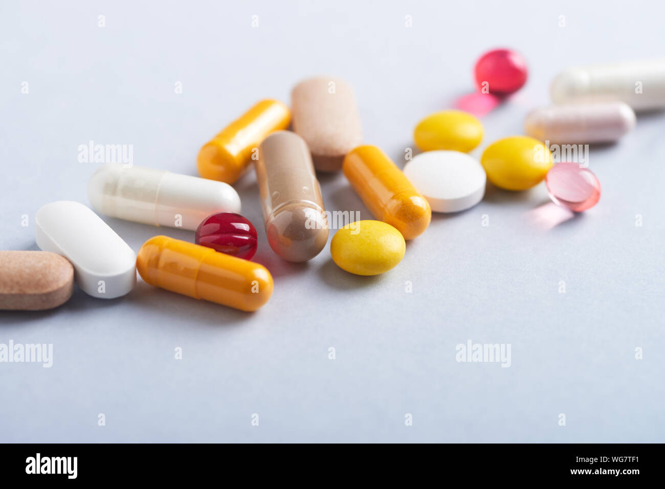 Vitamins and supplements on bright paper background. Concept for a ...