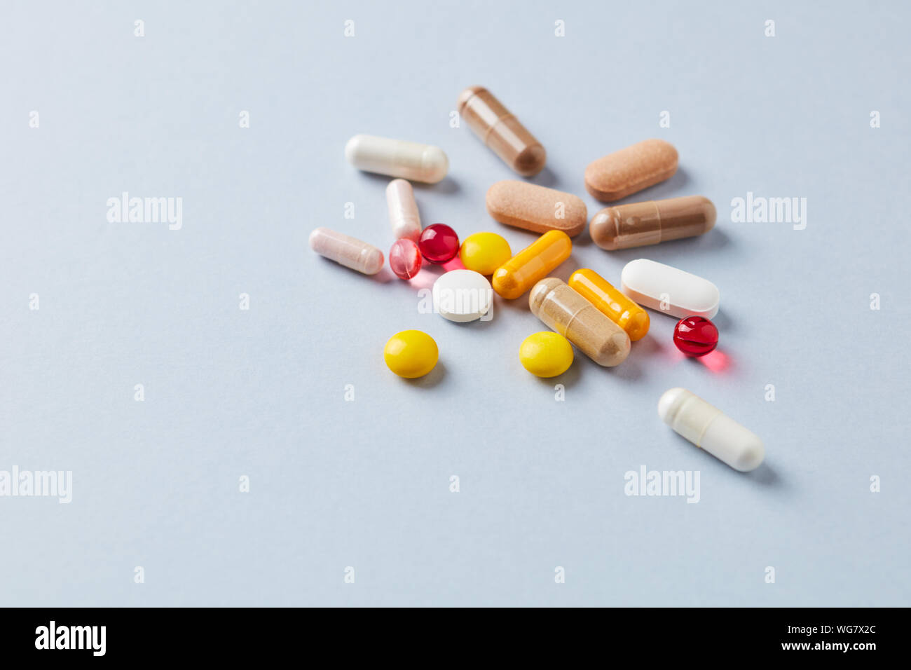Vitamins and supplements on bright paper background. Concept for a ...