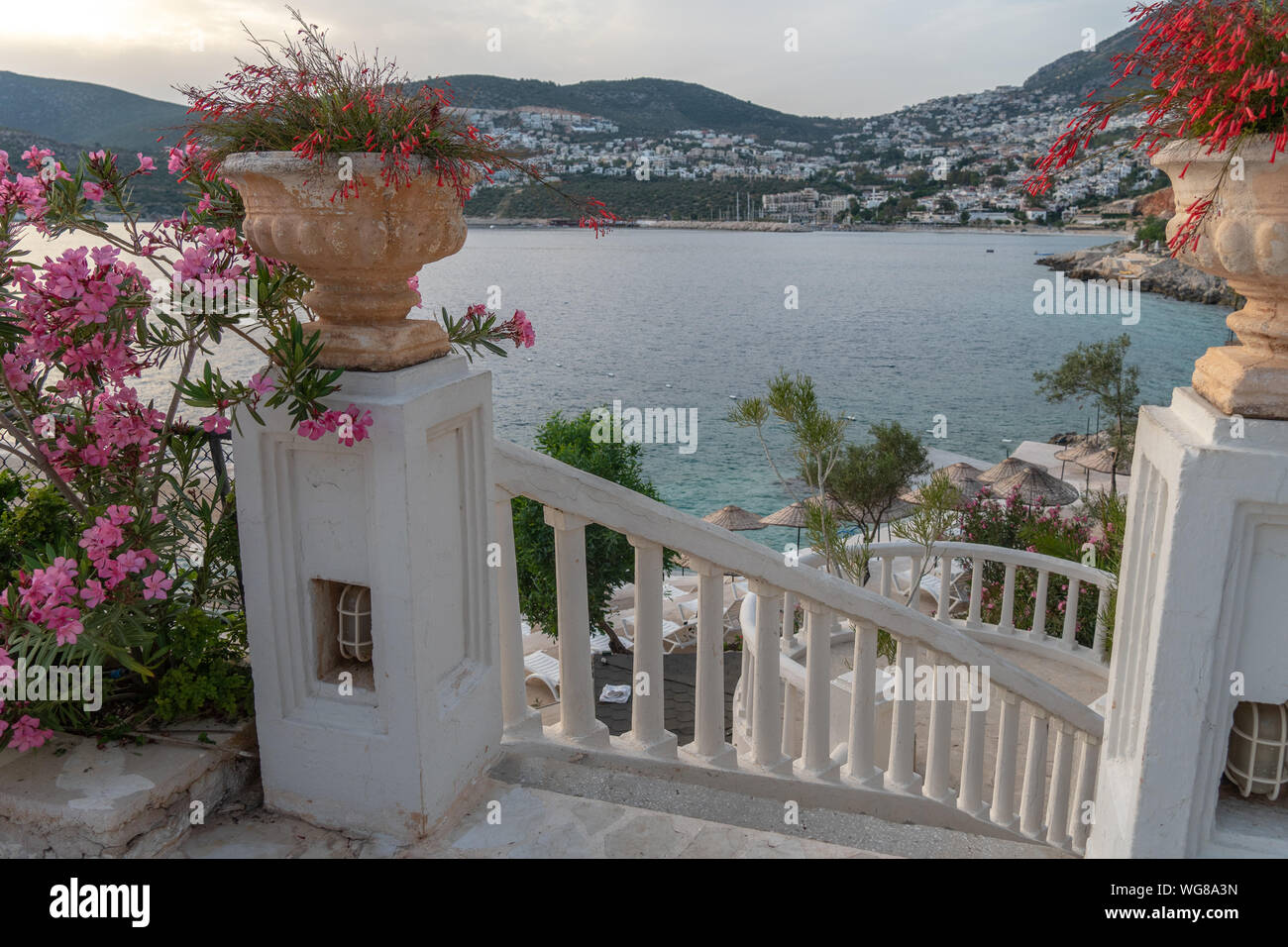Winding staircase and flowers with Kalkan city in background Stock ...