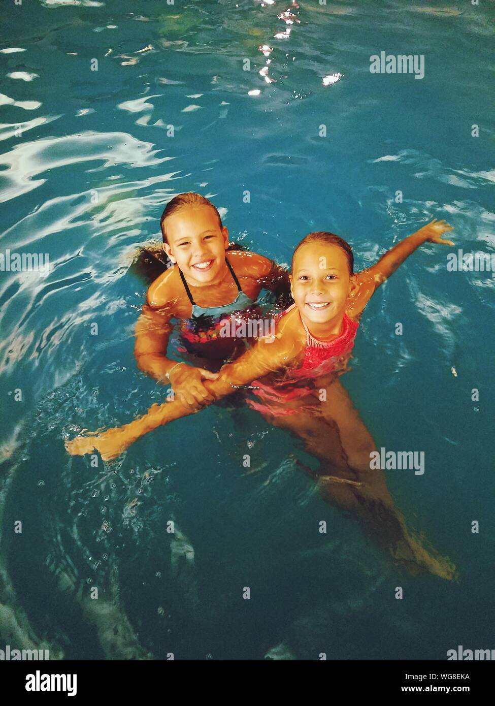Sisters in swimming pool High Resolution Stock Photography and Images ...