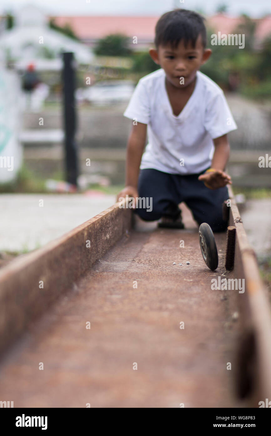 Boy playing wheel hi-res stock photography and images - Alamy