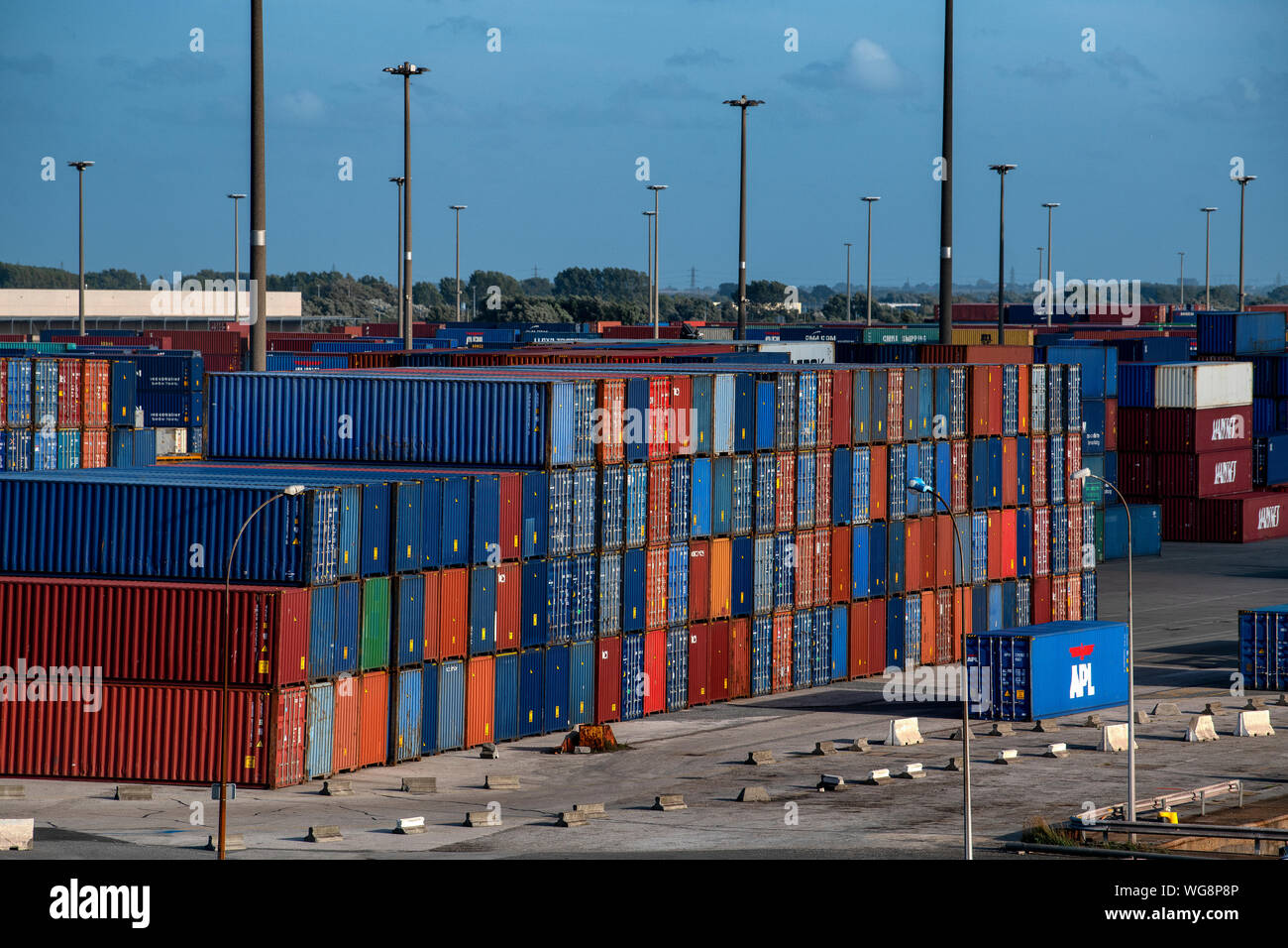 The port of Dunkerque in Northern France. Cranes load container ships ...