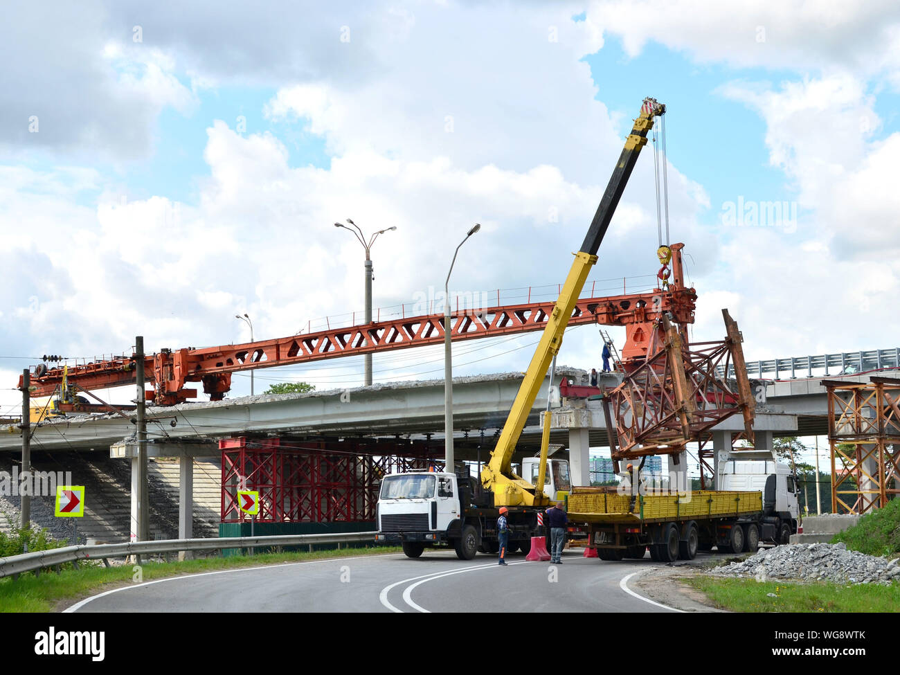 Truck crane working on a construction site. Loading cargo on a truck ...