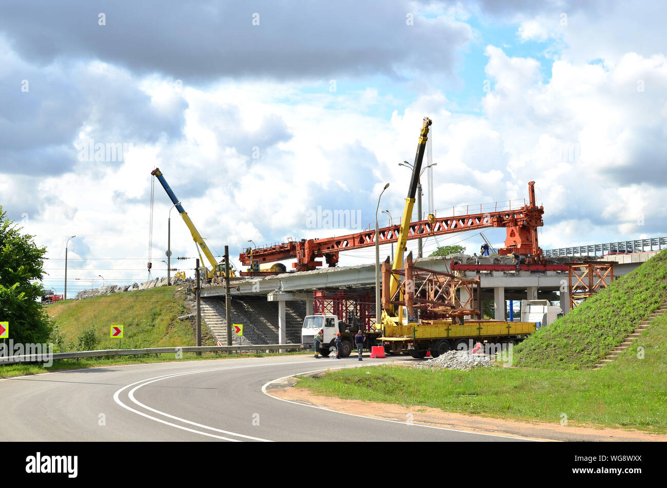 Truck crane working on a construction site. Loading cargo on a truck ...