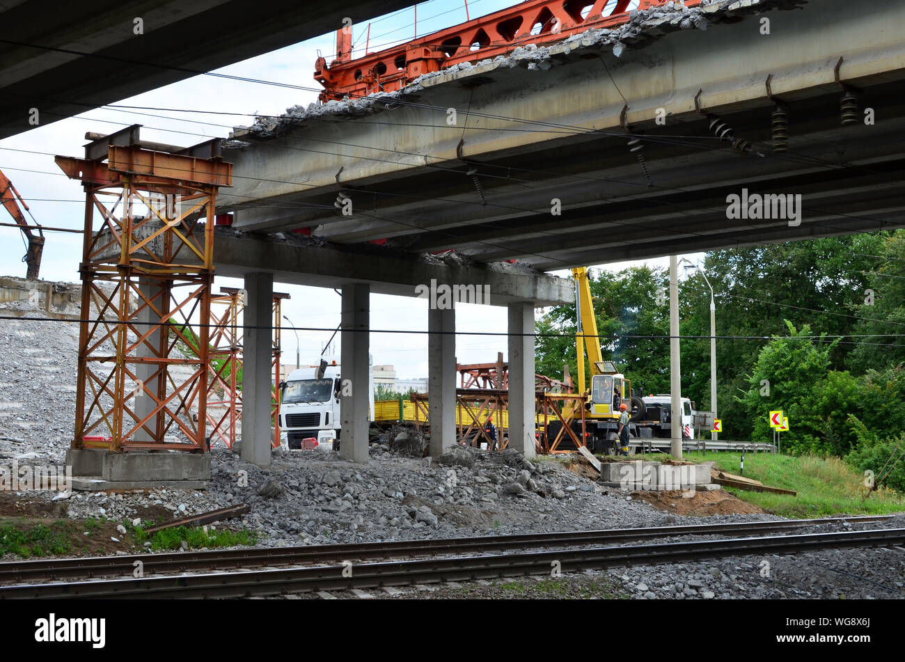 Truck crane working on a construction site. Loading cargo on a truck ...