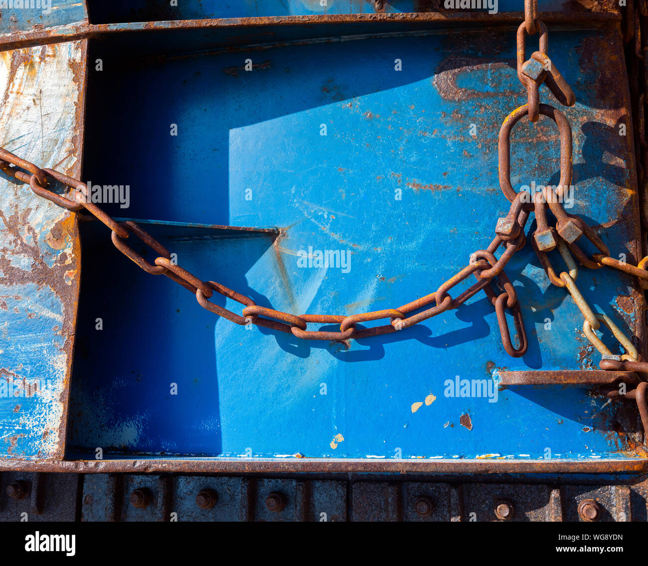 abstract blue part of rusty sheep hull and metal chain Stock Photo - Alamy
