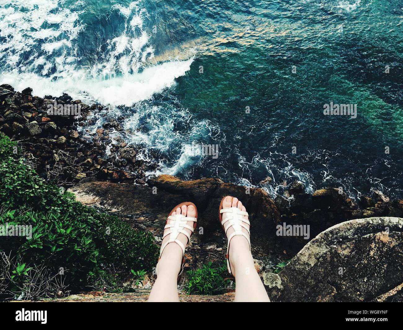 Women dangling legs hi-res stock photography and images - Alamy