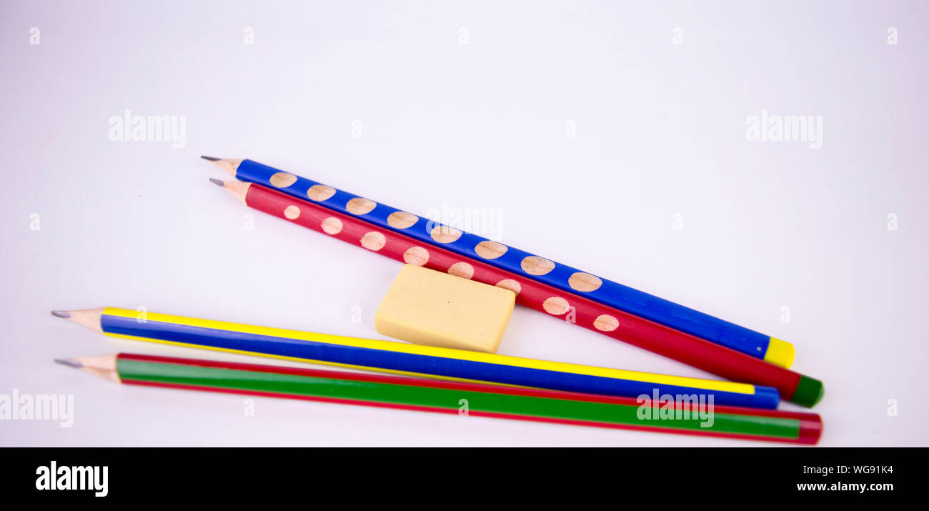colored pencils with eraser to erase on a white background, there is ...