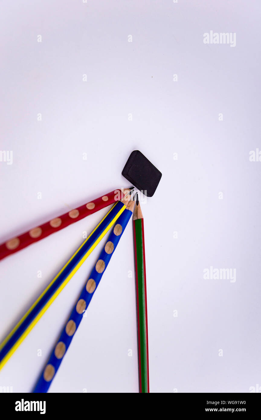 colored pencils with eraser to erase on a white background, there is ...