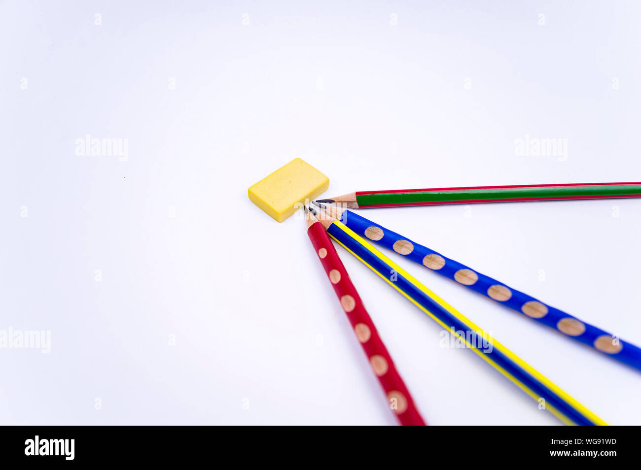 colored pencils with eraser to erase on a white background, there is ...