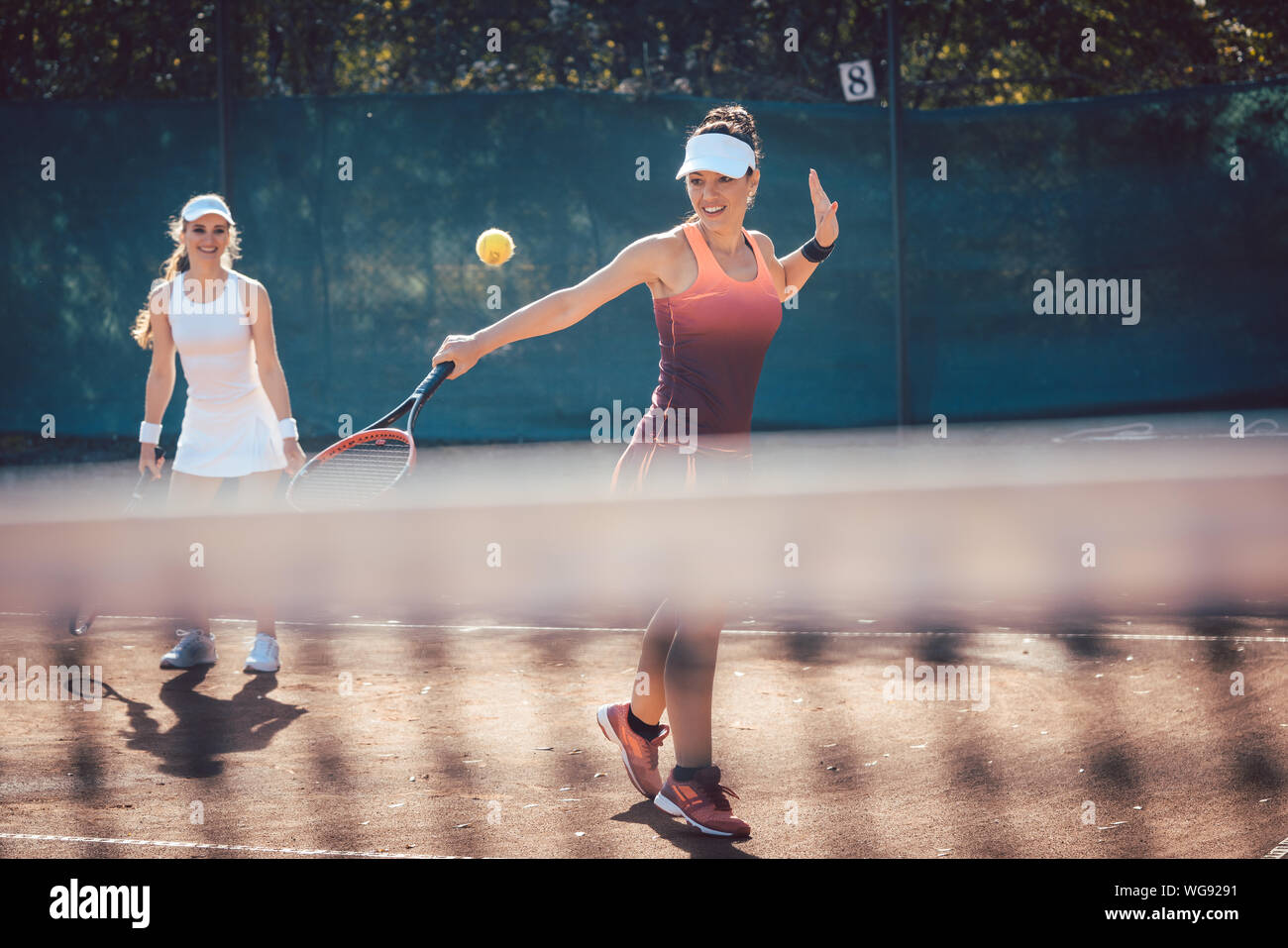 Woman play tennis doubles hi-res stock photography and images - Alamy