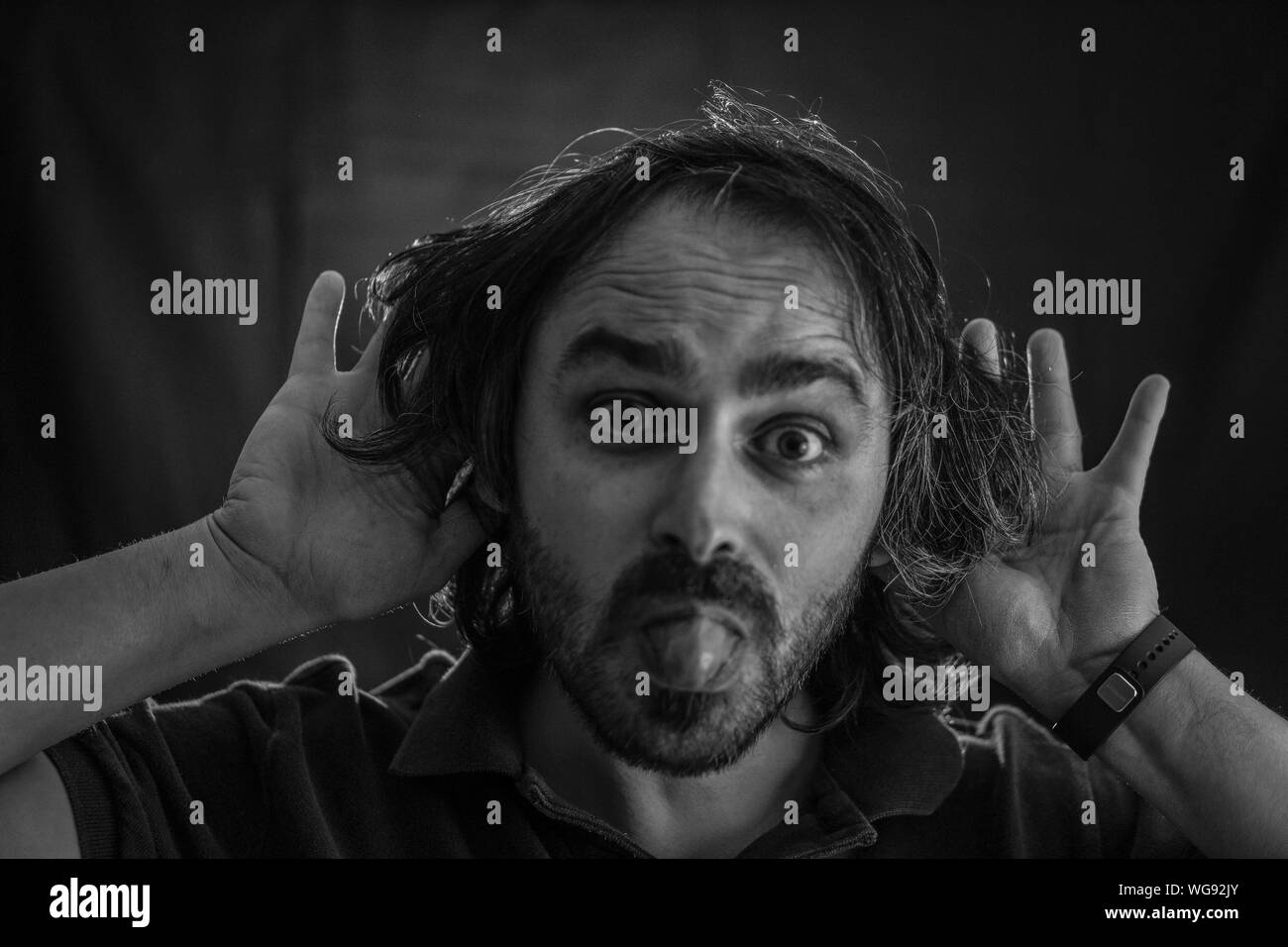 Teasing tongue man Black and White Stock Photos & Images - Alamy