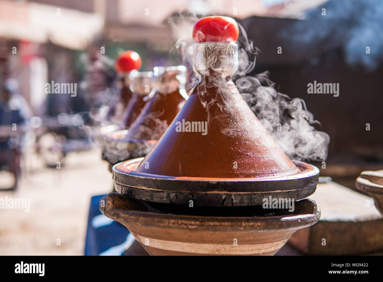 Authentic food of Morocco - traditional Tajine in steam vapor on an ...