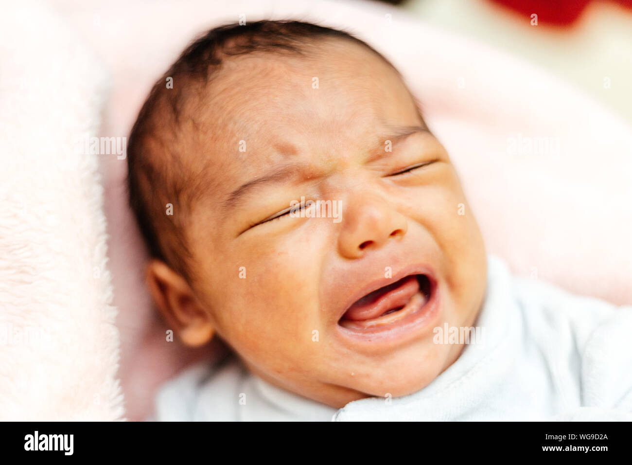 Baby Lying Down Crying High Resolution Stock Photography and Images - Alamy