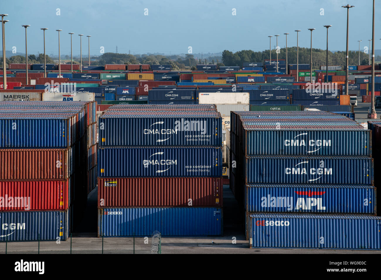 The port of Dunkerque in Northern France. Cranes load container ships ...