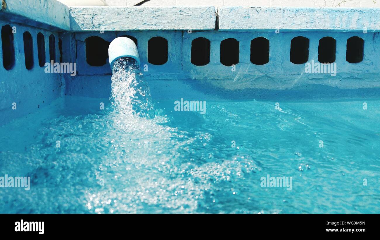Water From Pipe Falling In Swimming Pool Stock Photo - Alamy
