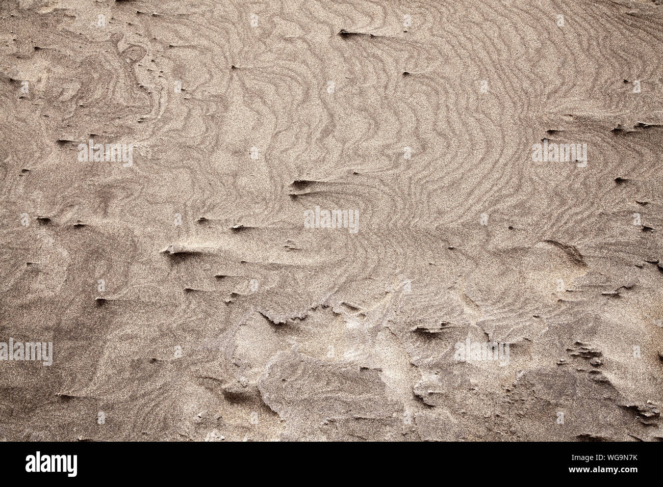 sand and wind pattern on surface made solid with dried spray, Lanzarote ...