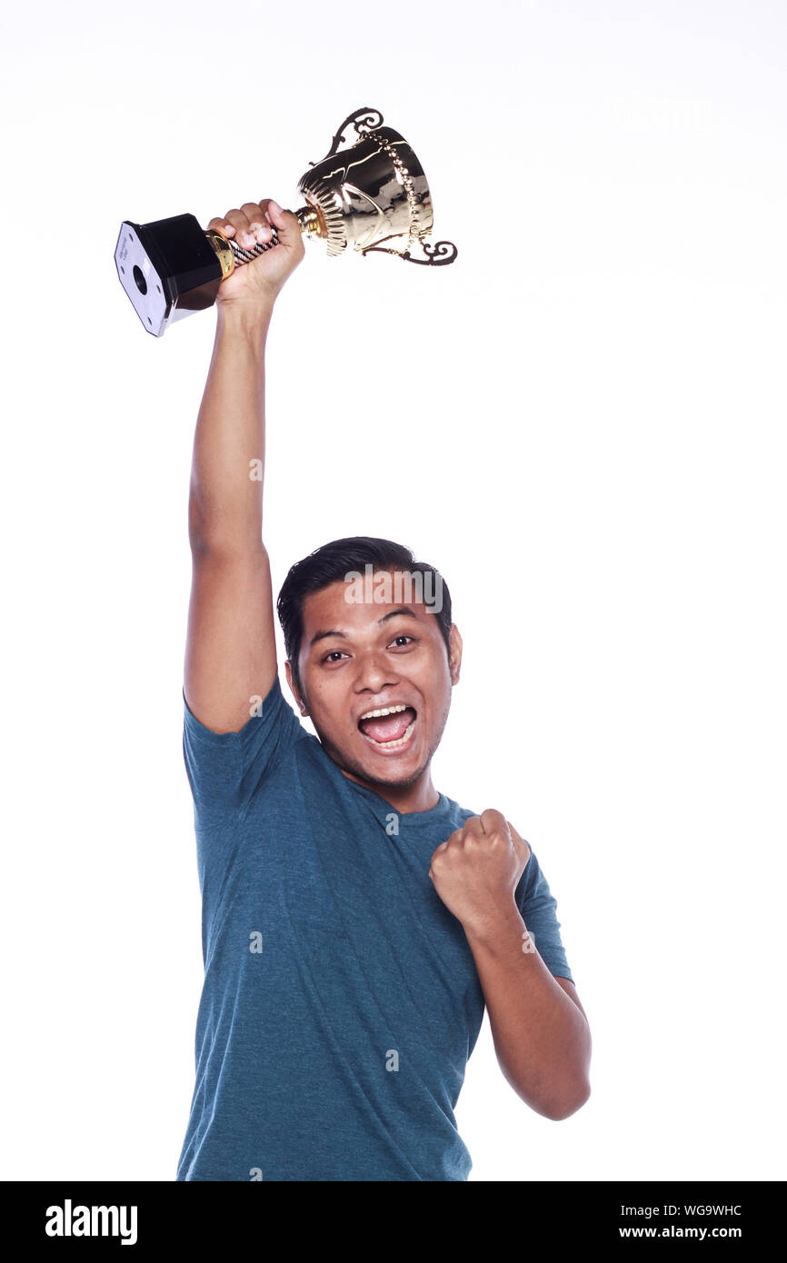 Man holding up trophy hi-res stock photography and images - Alamy