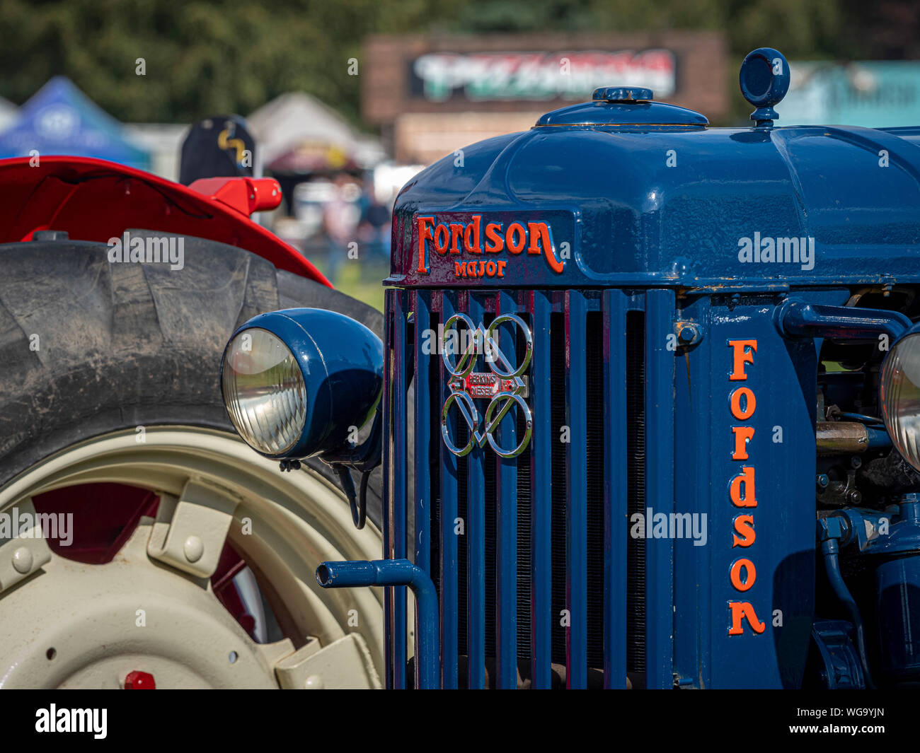 Front of blue Fordson vintage tractor with red lettering Stock Photo ...