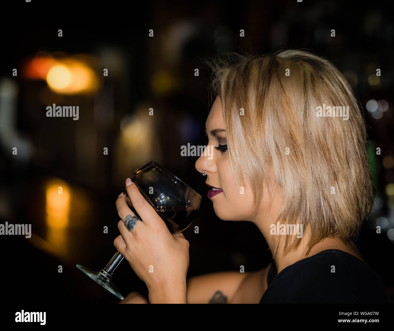 Woman drinking alcohol bar hi-res stock photography and images - Alamy