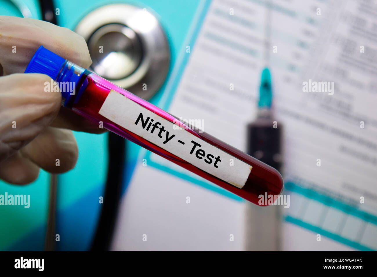 Nifty - Test with blood sample. Top view isolated on office desk ...