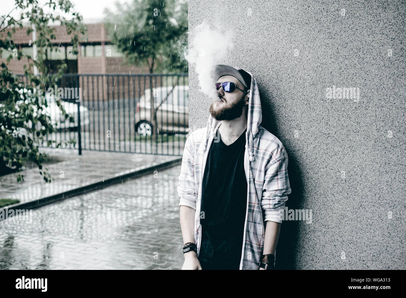 Rainy Day Man Smoking High Resolution Stock Photography and Images - Alamy