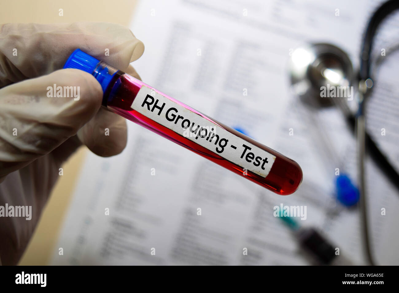 RH Grouping - Test with blood sample. Top view isolated on office desk ...