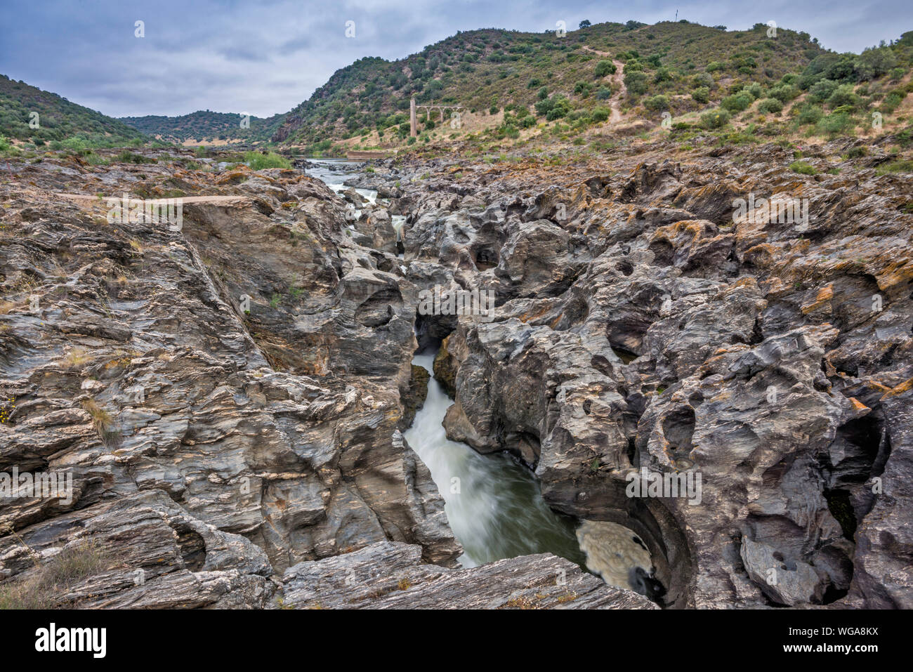 Schist metamorphic rocks over Pulo do Lobo waterfall on Rio Guadiana ...