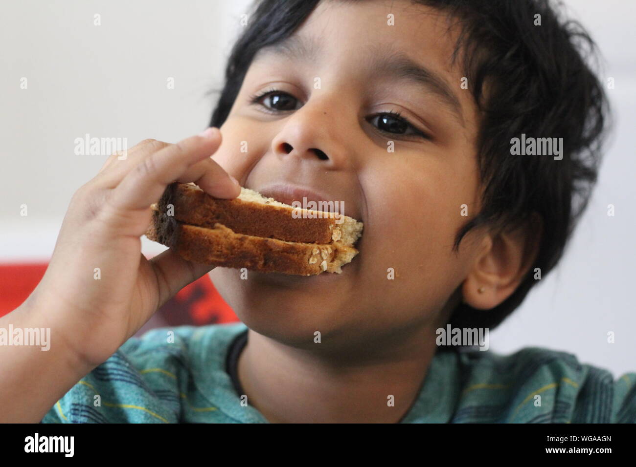 Boy Eating Bread High Resolution Stock Photography and Images - Alamy