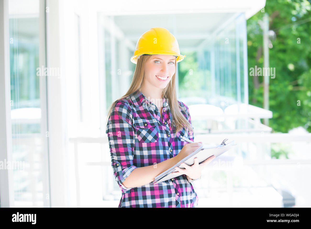 Beautiful female engineer wearing helmet hi-res stock photography and ...