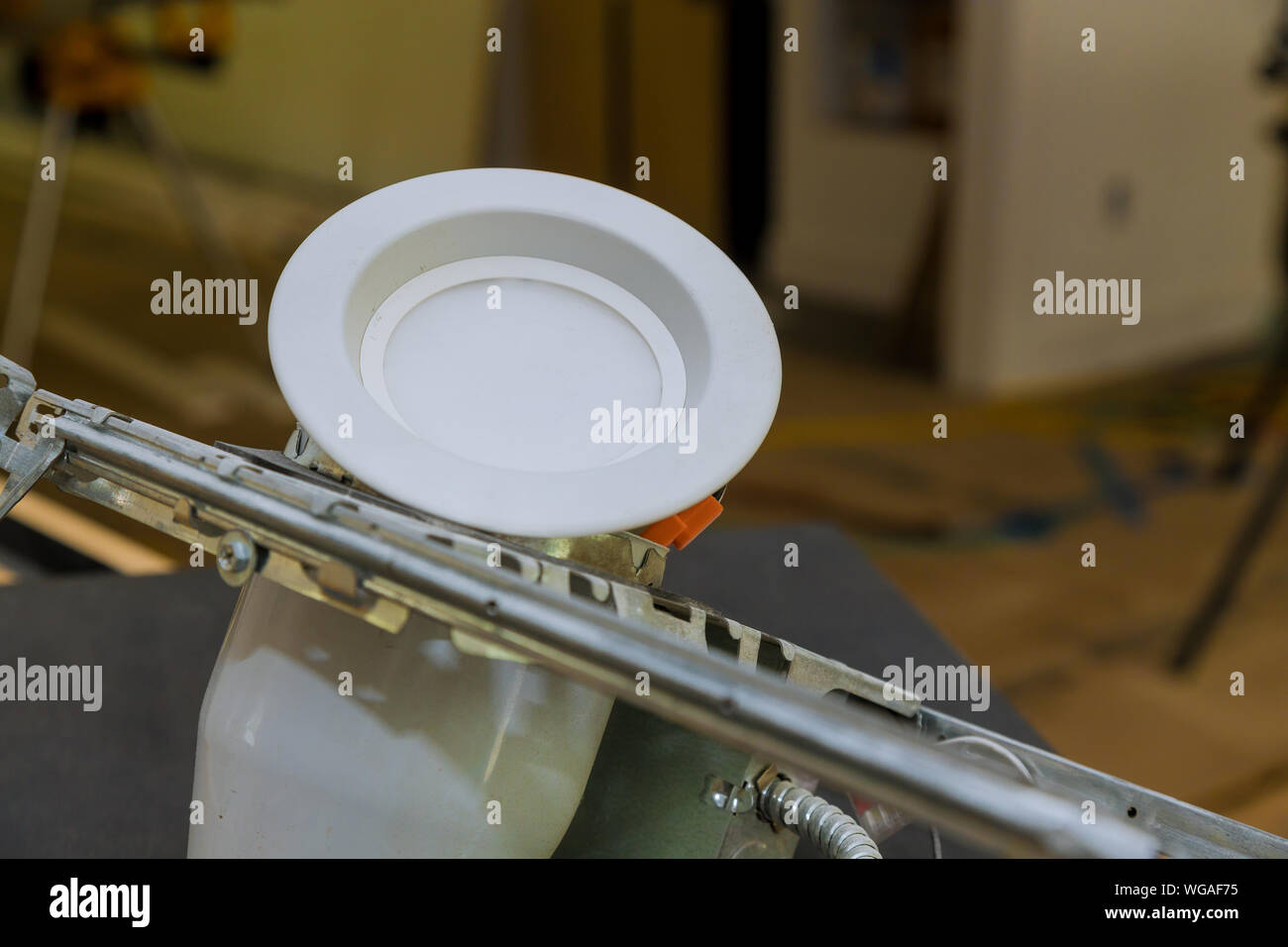 Installing electrical light in the ceiling maintenance replacing repair ...