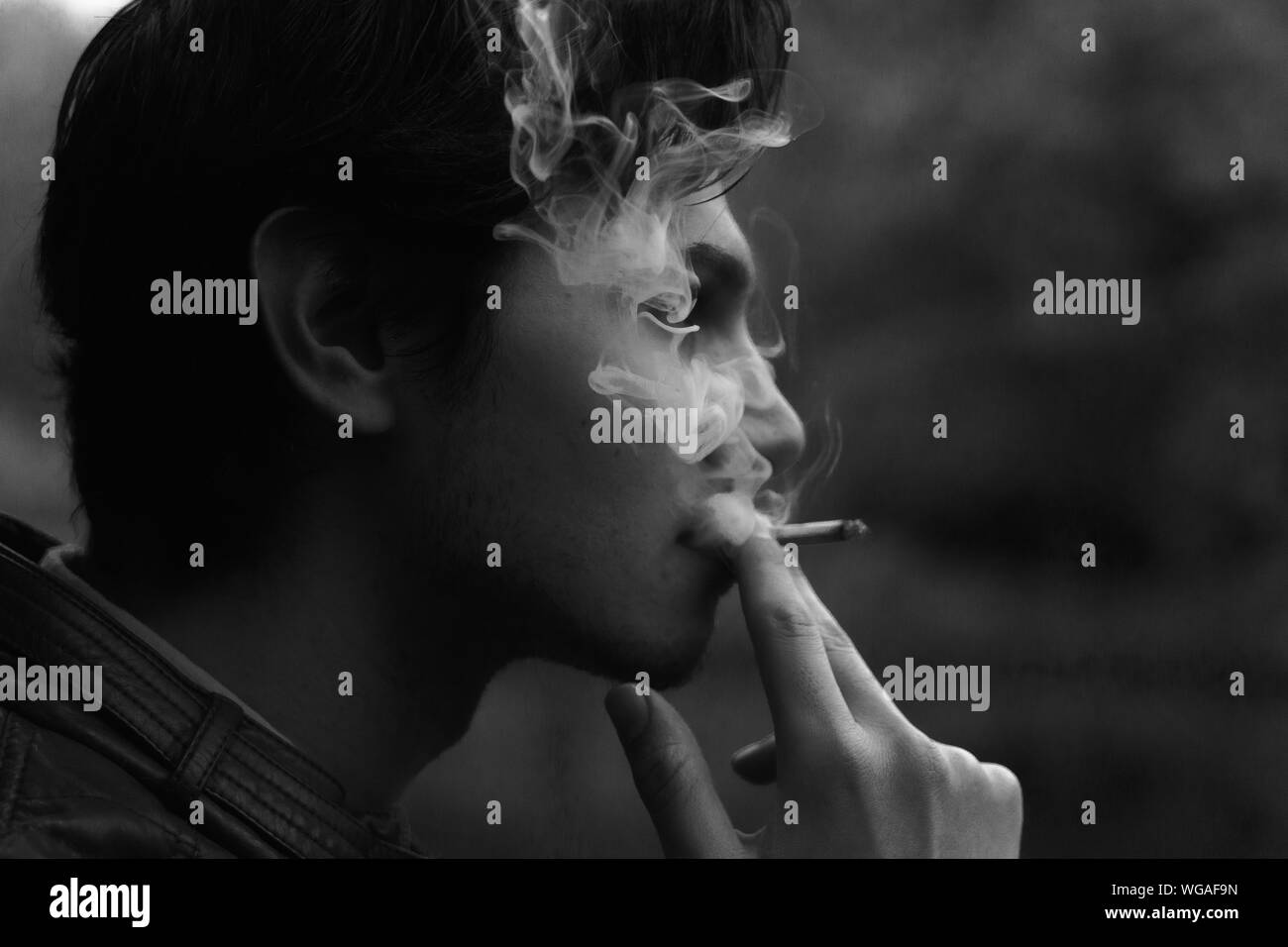 Smoking smoke side Black and White Stock Photos & Images - Alamy