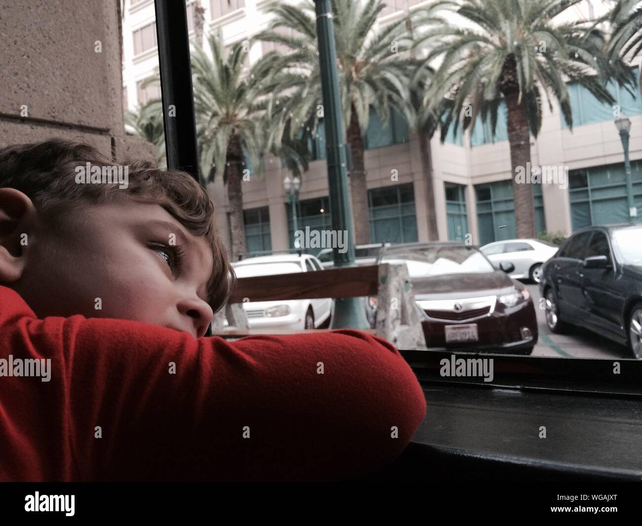 Boy window sill hi-res stock photography and images - Alamy