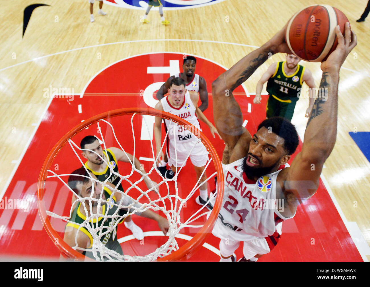 Dongguan. 1st Sep, 2019. Khem Birch (front) of Canada dunks during the ...