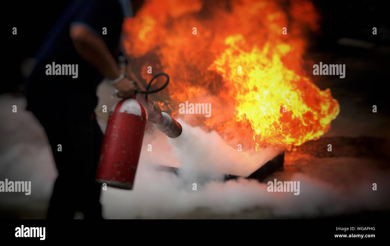Man fire extinguisher hi-res stock photography and images - Alamy
