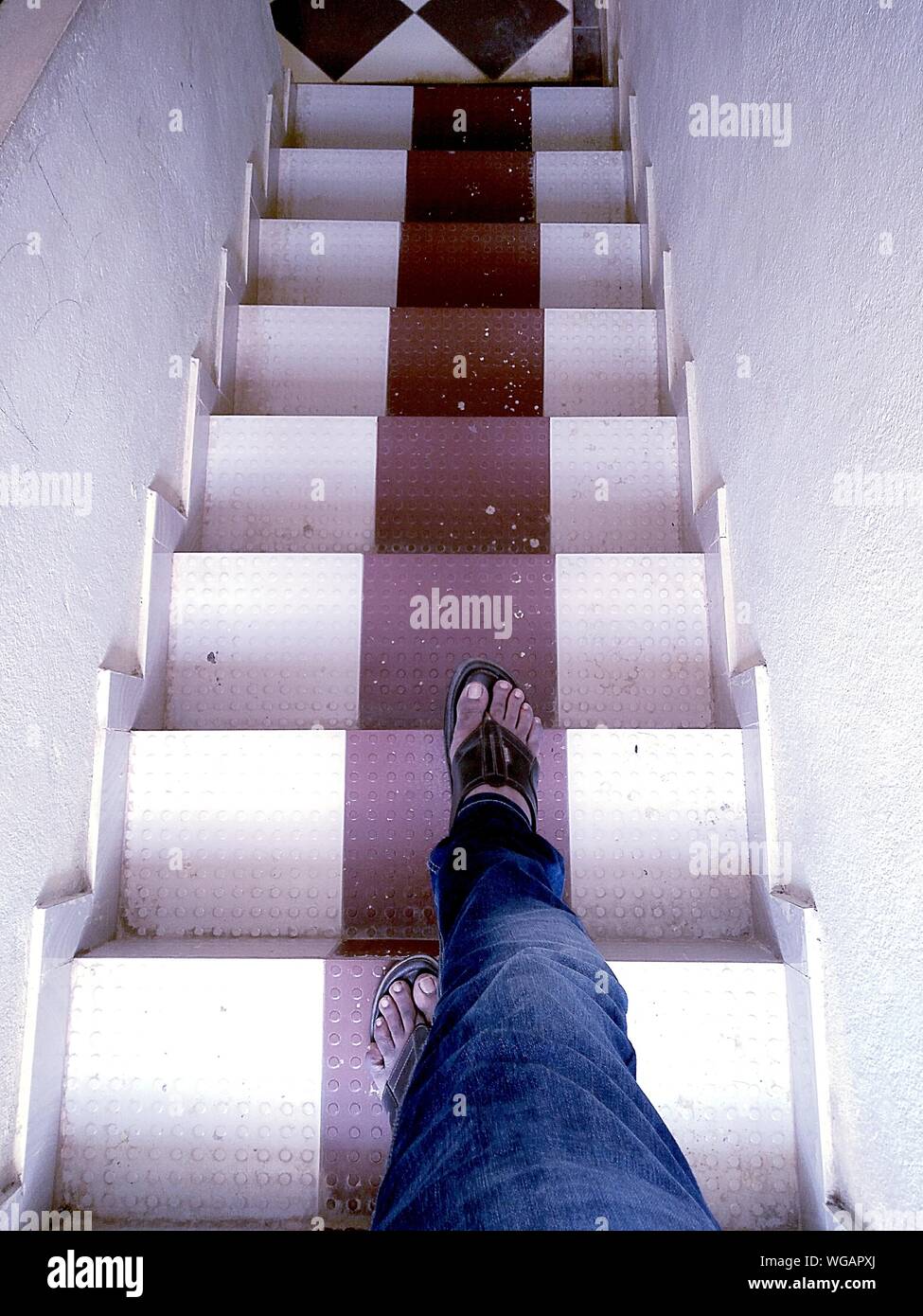 Walking down stairs low angle hi-res stock photography and images - Alamy