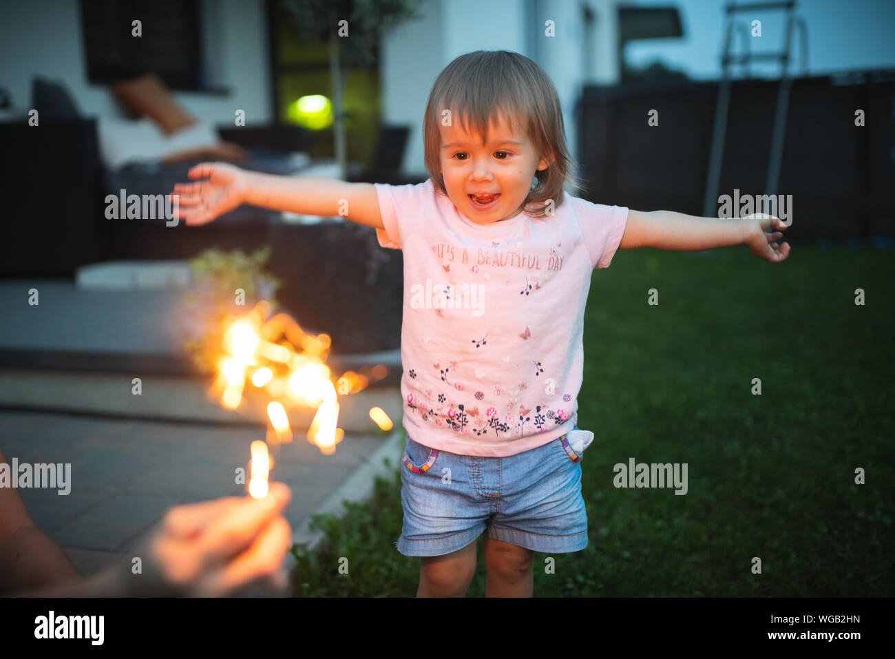 Child lighting fireworks hi-res stock photography and images - Alamy