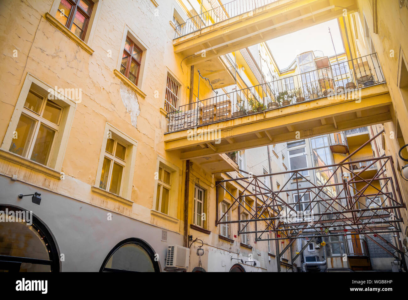yellow house with inner courtyard Stock Photo - Alamy