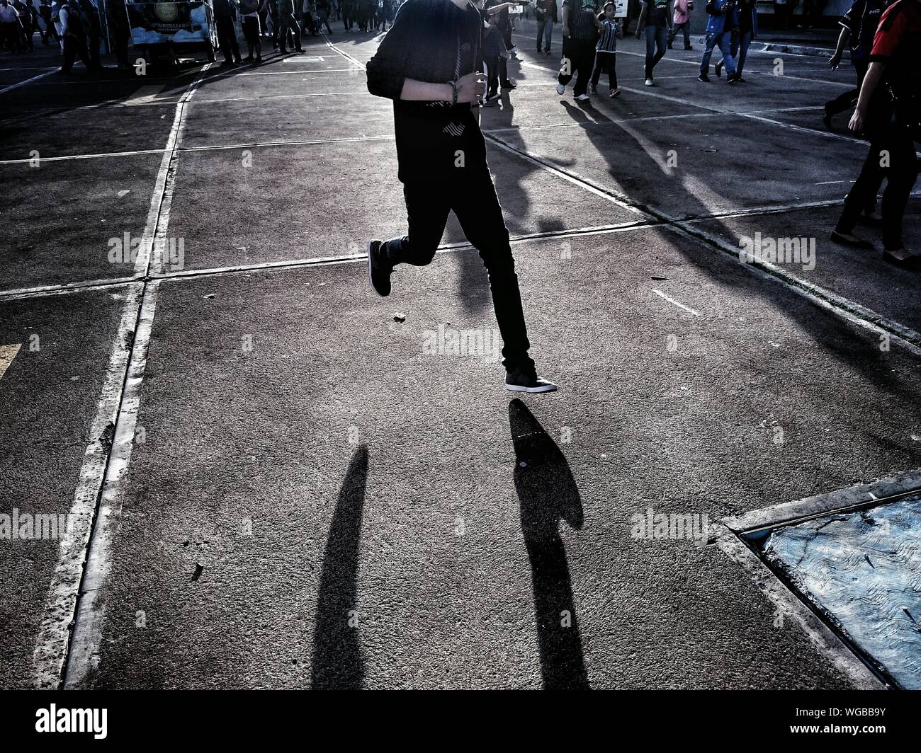 Shadow man running on street hi-res stock photography and images - Alamy